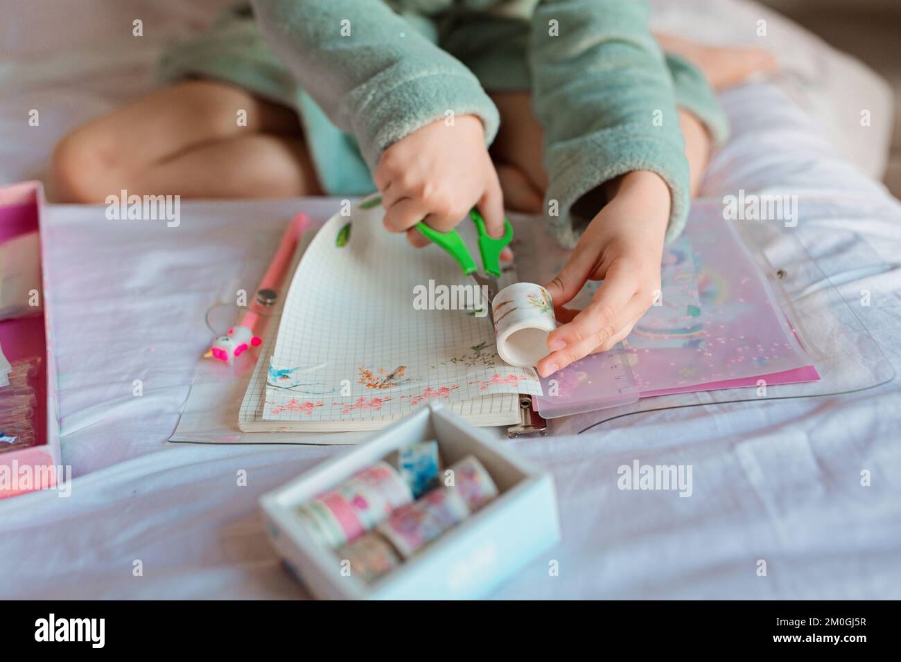 Hand-crafted art made by child. Little caucasian girl 6-7 years old ...