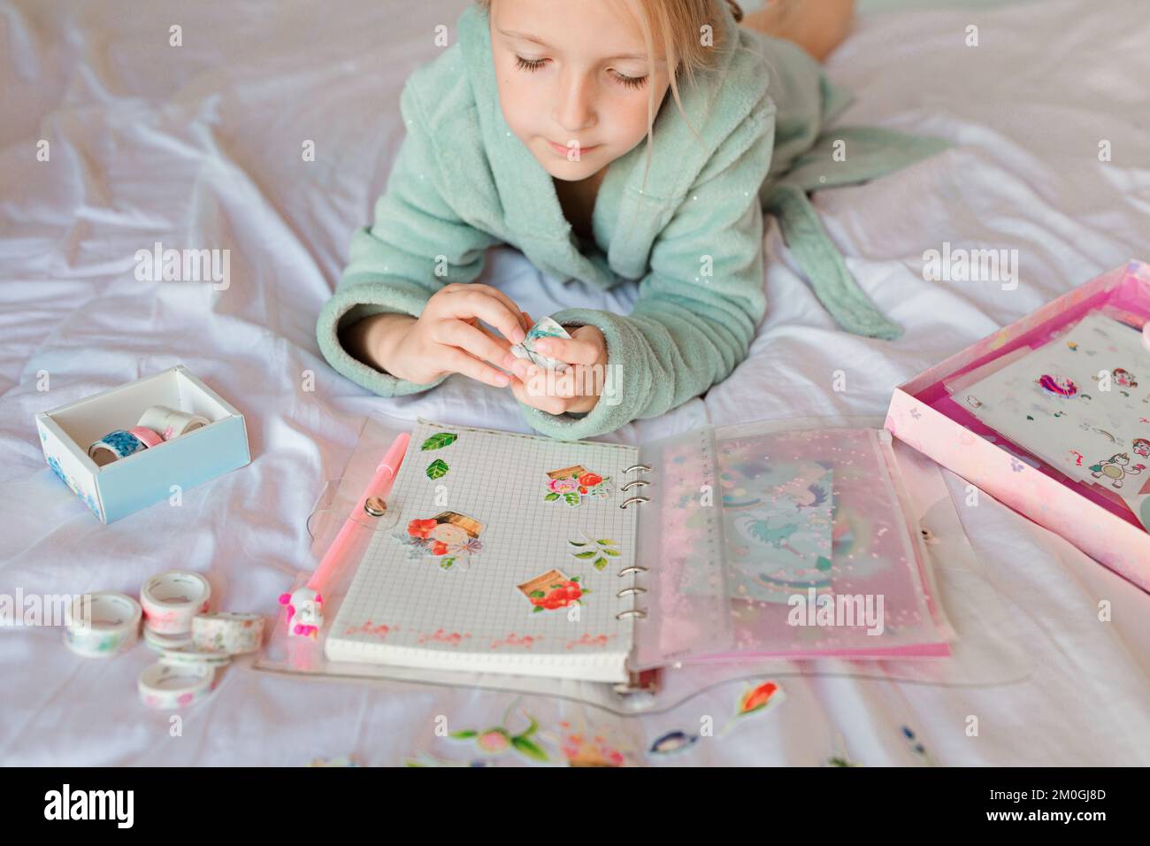 Hand-crafted art made by child. Little caucasian girl 6-7 years old ...