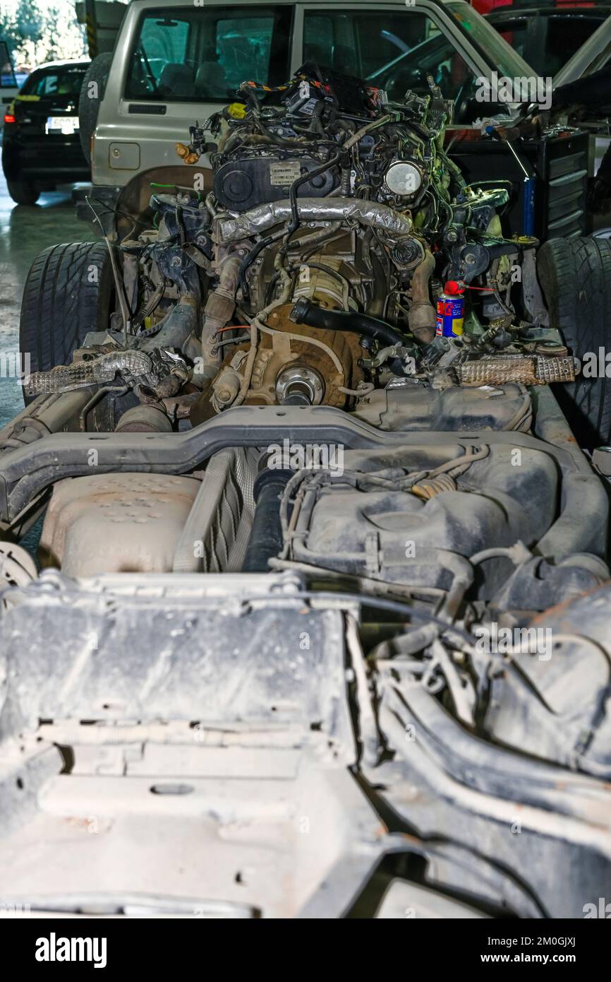 Auto mechanic working on car engine in mechanic garage Stock Photo - Alamy