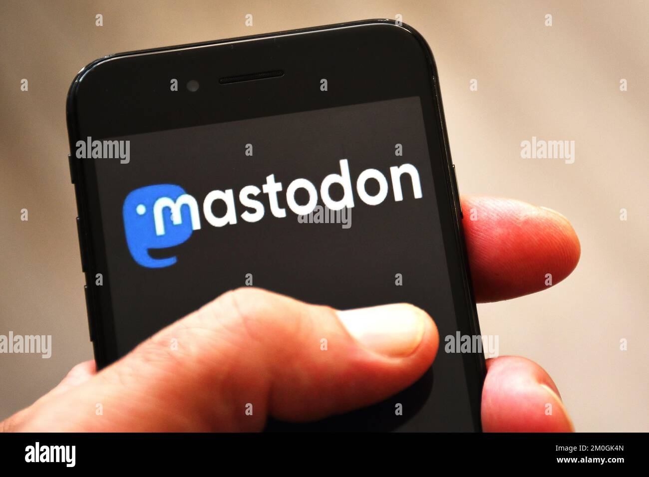 In this photo illustration, a smartphone with the Mastodon logo ...