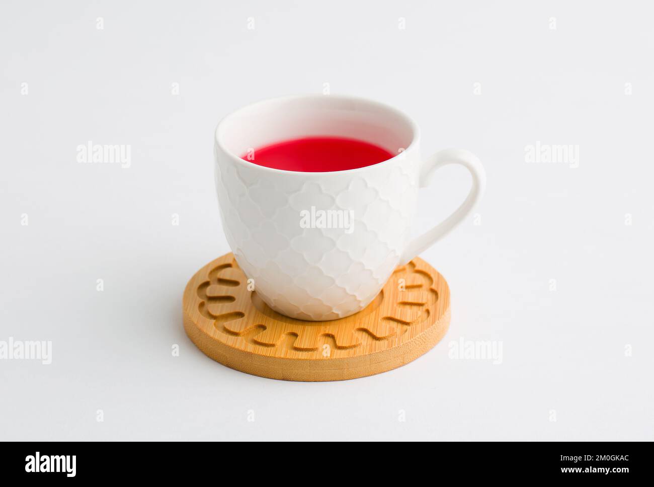 cup of hot aromatic healthy herbal rooibos or hibiscus red tea. A ...