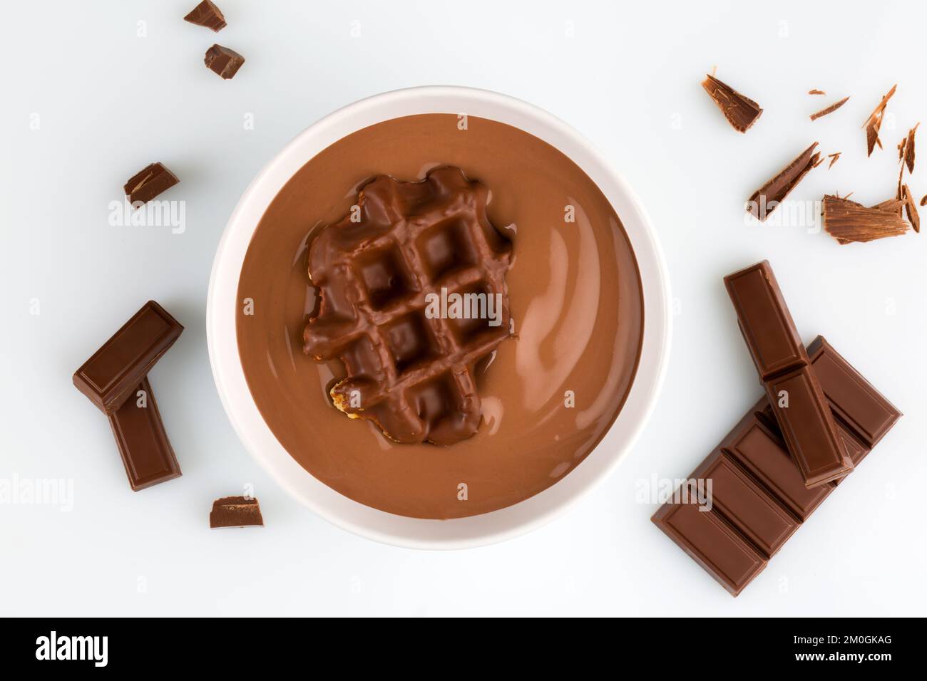 Chocolate pudding in a bowl with chocolate bar top view isolated on ...