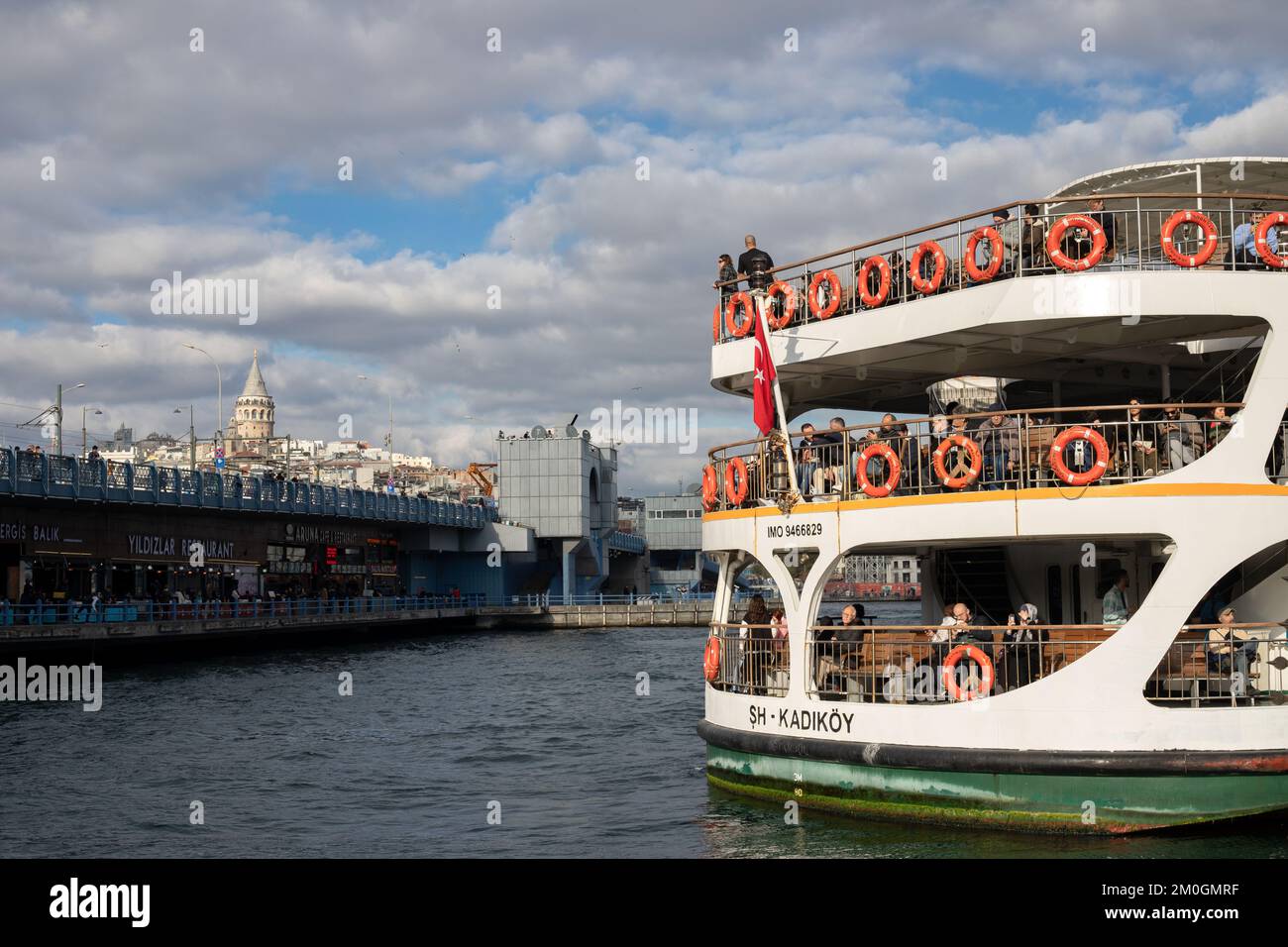 stanbul,Turkey - 11-11-2022:Galata bridge, galata tower and a ferry ...
