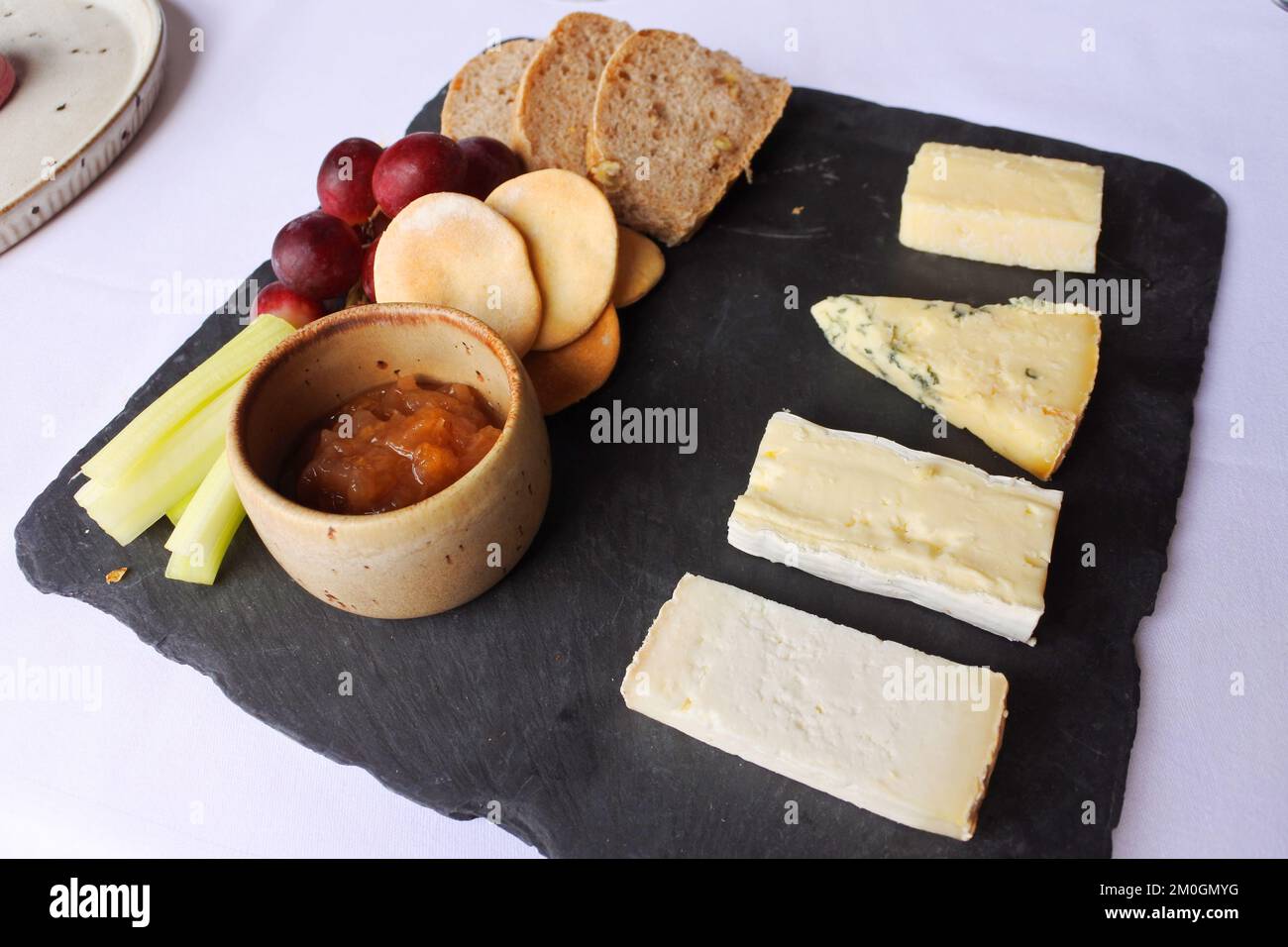 Cheese board served on a slate, UK - John Gollop Stock Photo - Alamy
