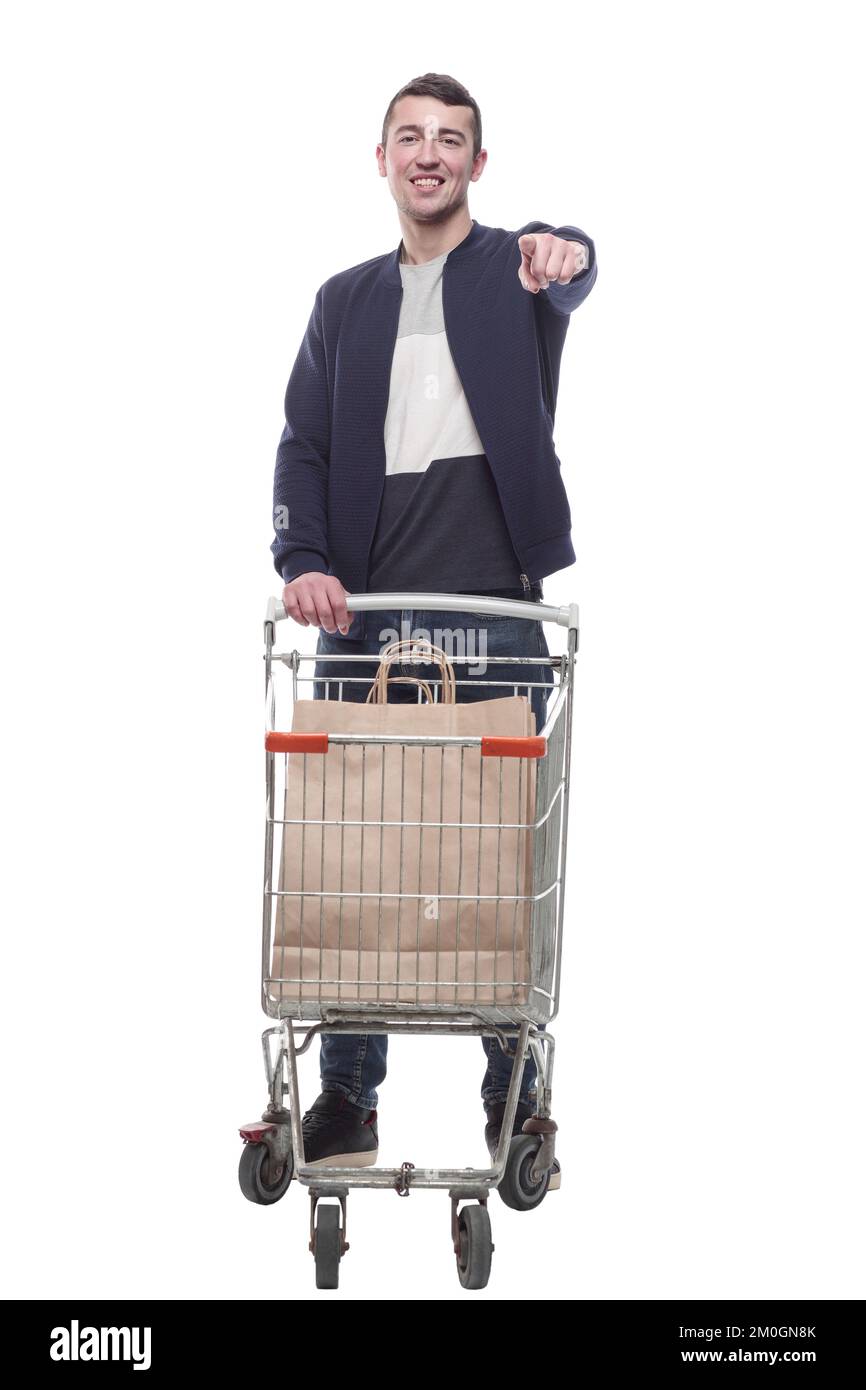 smiling young man with a shopping cart . isolated on a white Stock ...