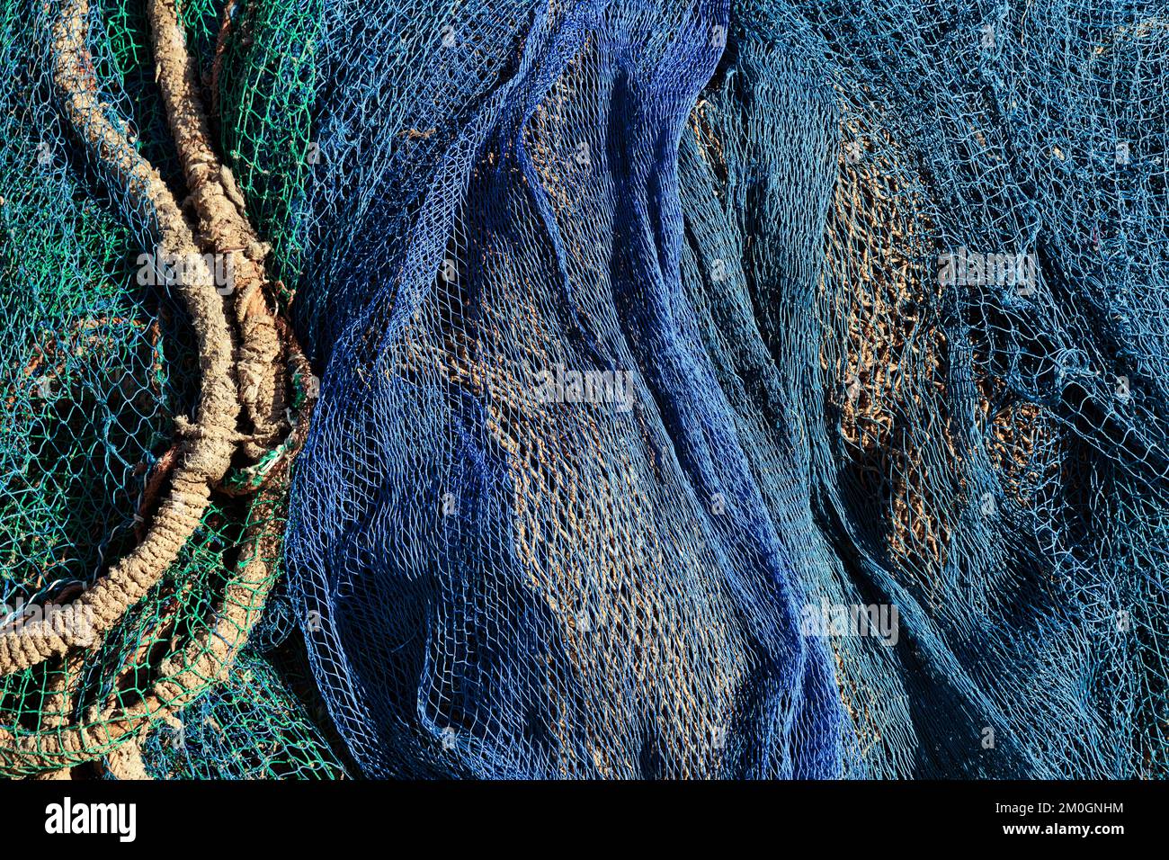 Turquoise fishing nets in the harbour, view from above, detail ...
