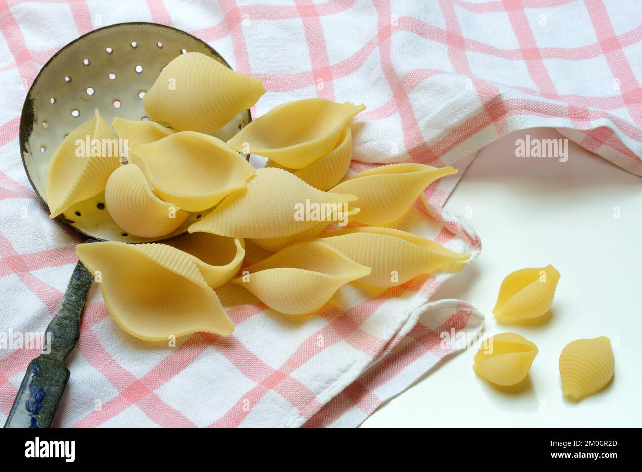 Conchiglione and small conchiglie with sieve ladle, shell pasta, pasta ...