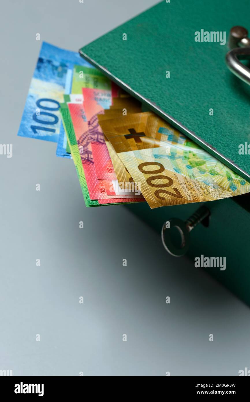 Cash box and Swiss banknotes, money, banknotes Stock Photo - Alamy