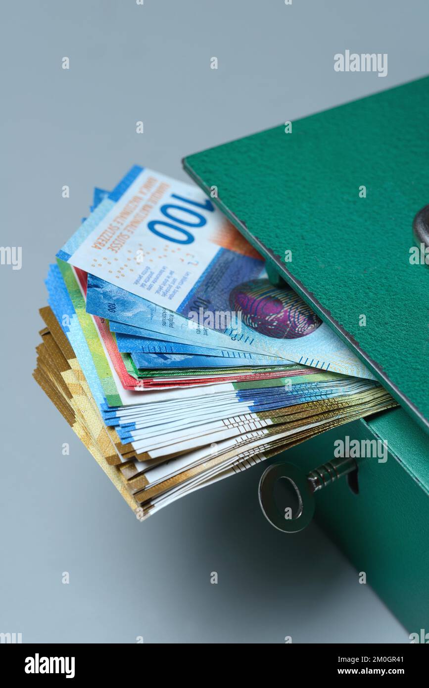 Cash box and Swiss banknotes, money, banknotes Stock Photo - Alamy