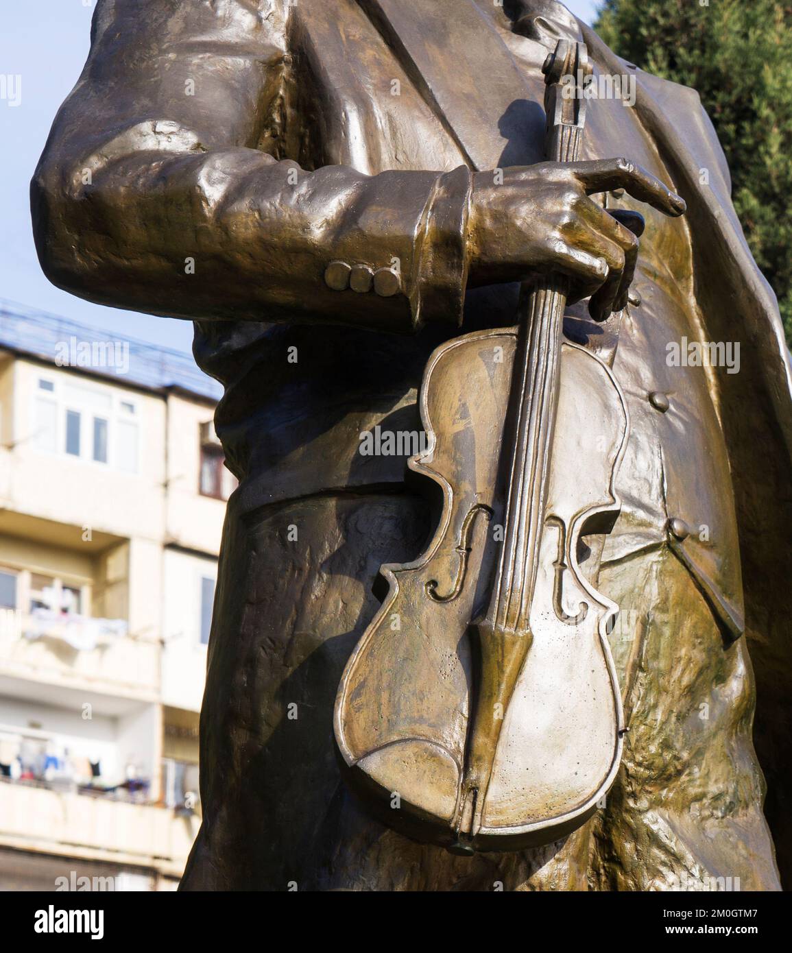 Old Bronze Statue in a Public Park of Musician holding a Violin Stock ...