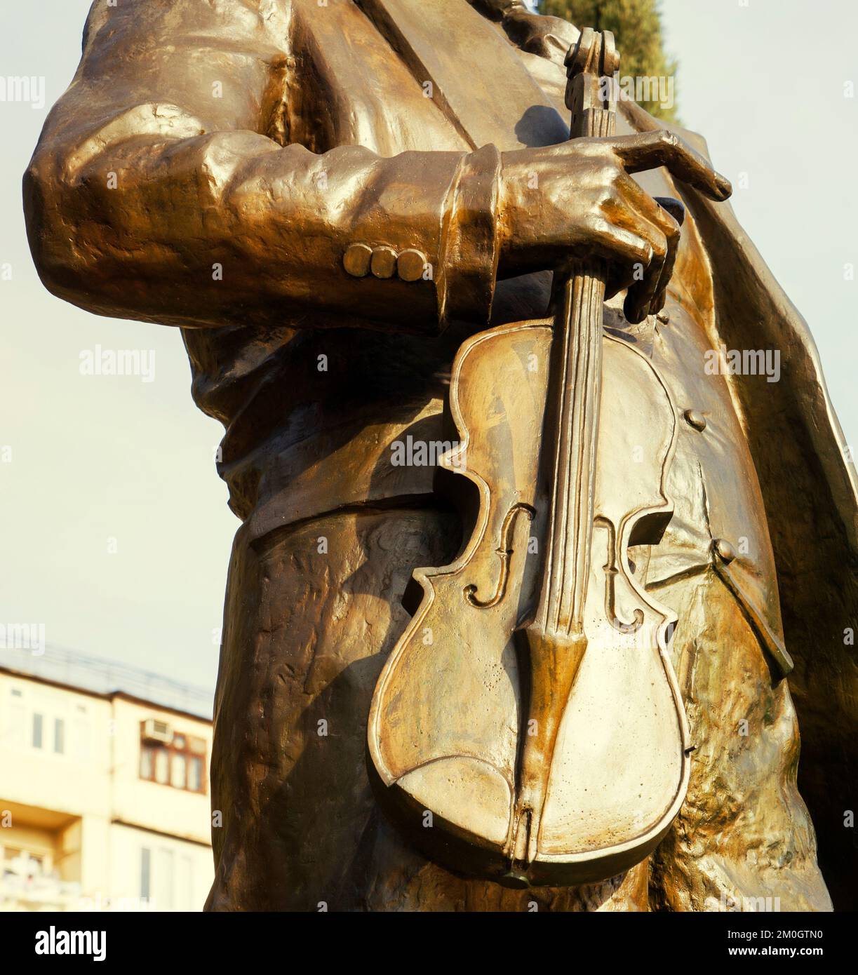 Old Bronze Statue in a Public Park of Musician holding a Violin Stock ...