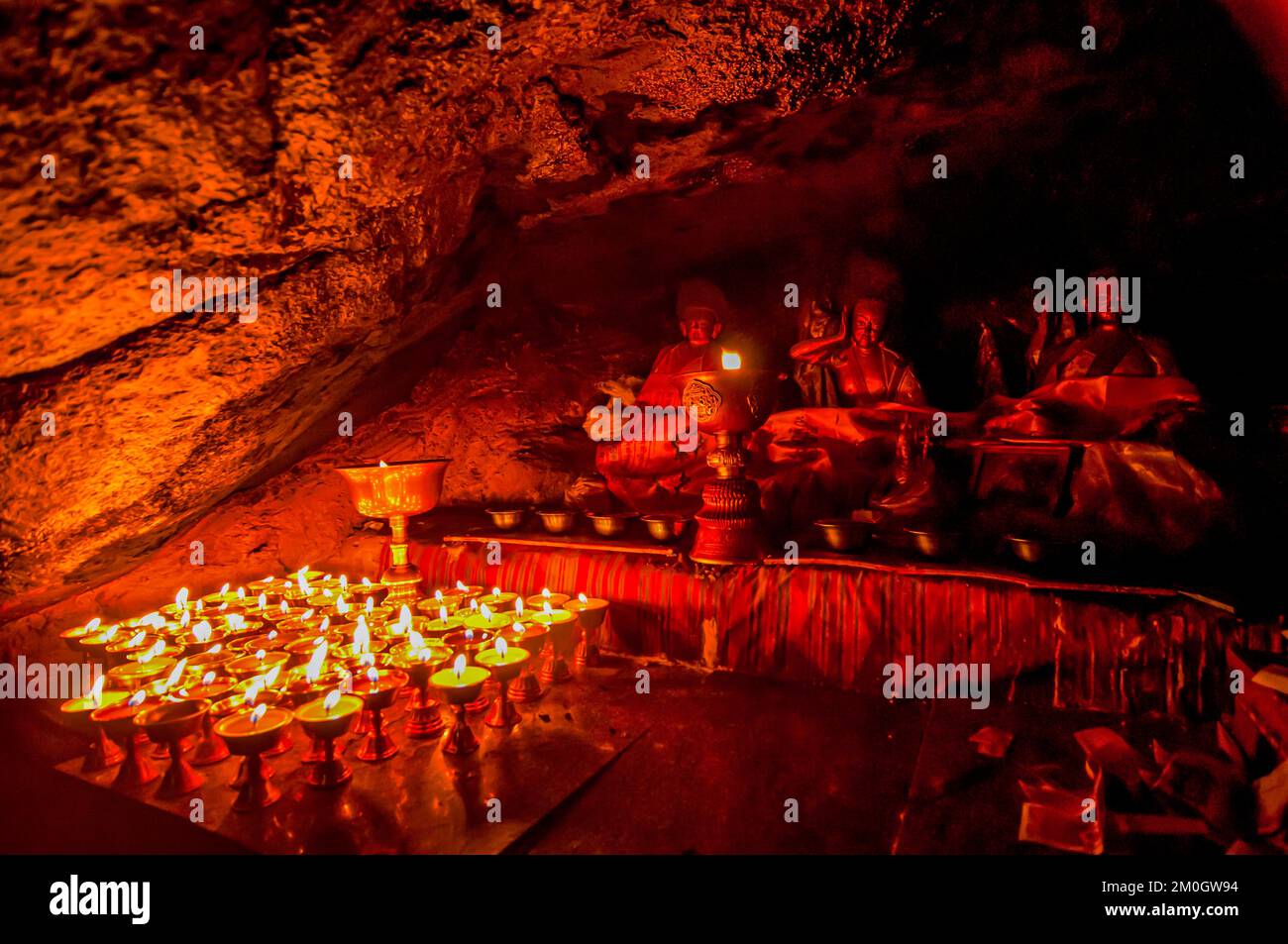 Buddhism candle cave hi-res stock photography and images - Alamy