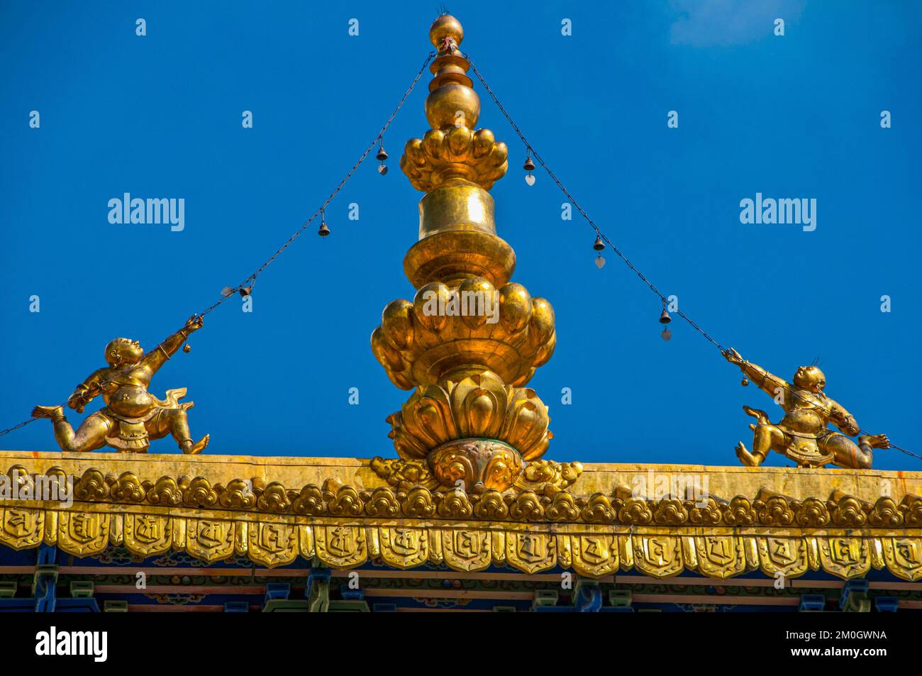 Buddhist roof decorations on the roof of the Tashilhunpo monastery ...