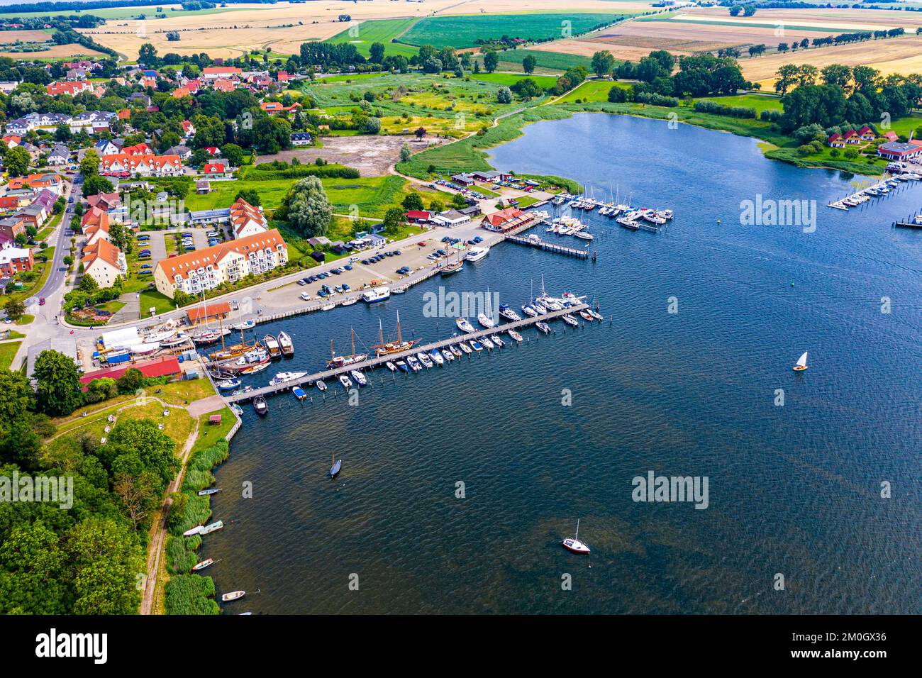 Aerial of Kirchdorf, Church village with its harbour on Poel Island ...