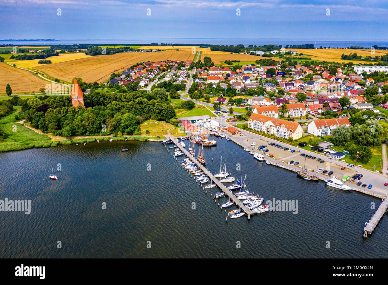 Aerial of Kirchdorf, Church village with its harbour on Poel Island ...