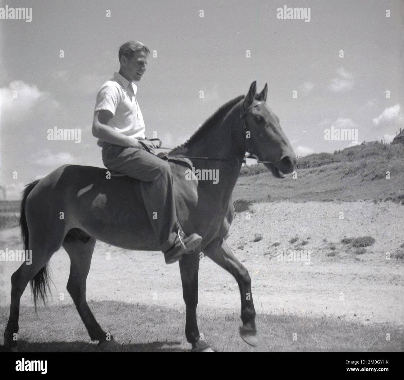 Black man riding white horse hi-res stock photography and images - Alamy