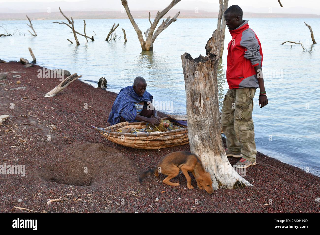 Men on a small fishing boat in Kenya Stock Photo - Alamy