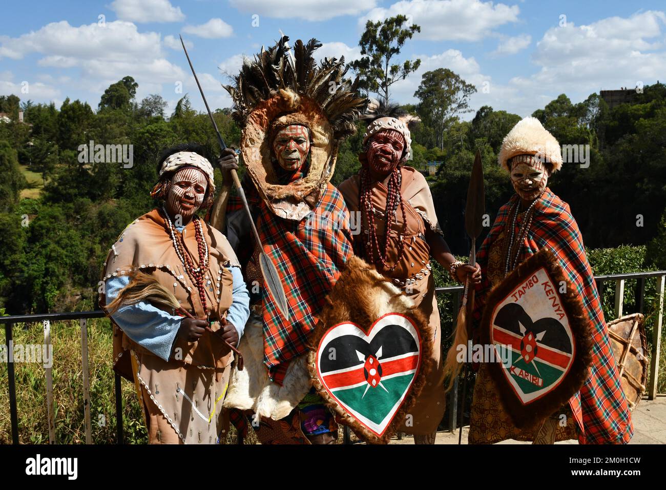 Kikuyu dancer with face paint poses for photographers at Nyahururu ...