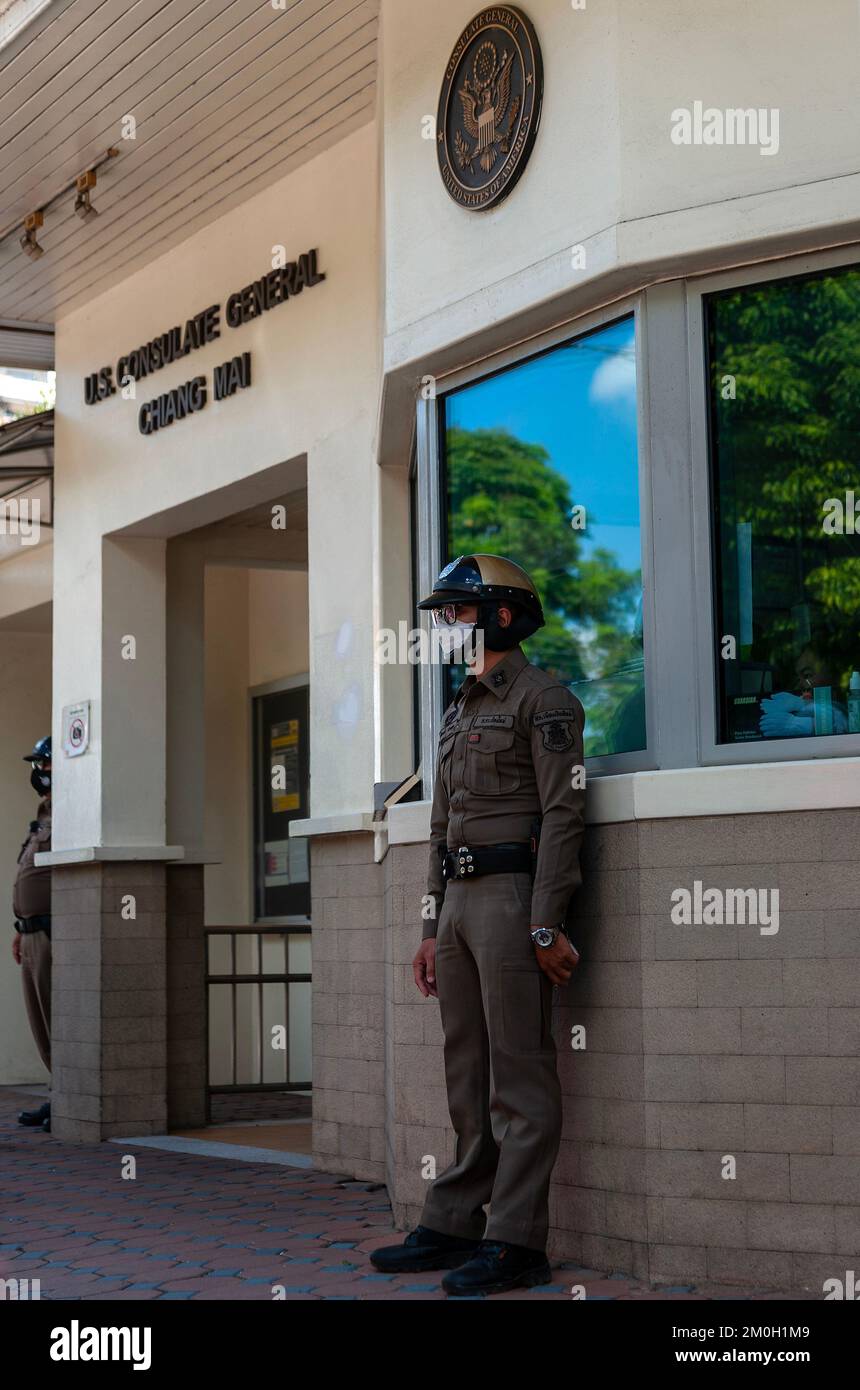 Thai police officer stands on guard as "Chiang Mai University Student ...