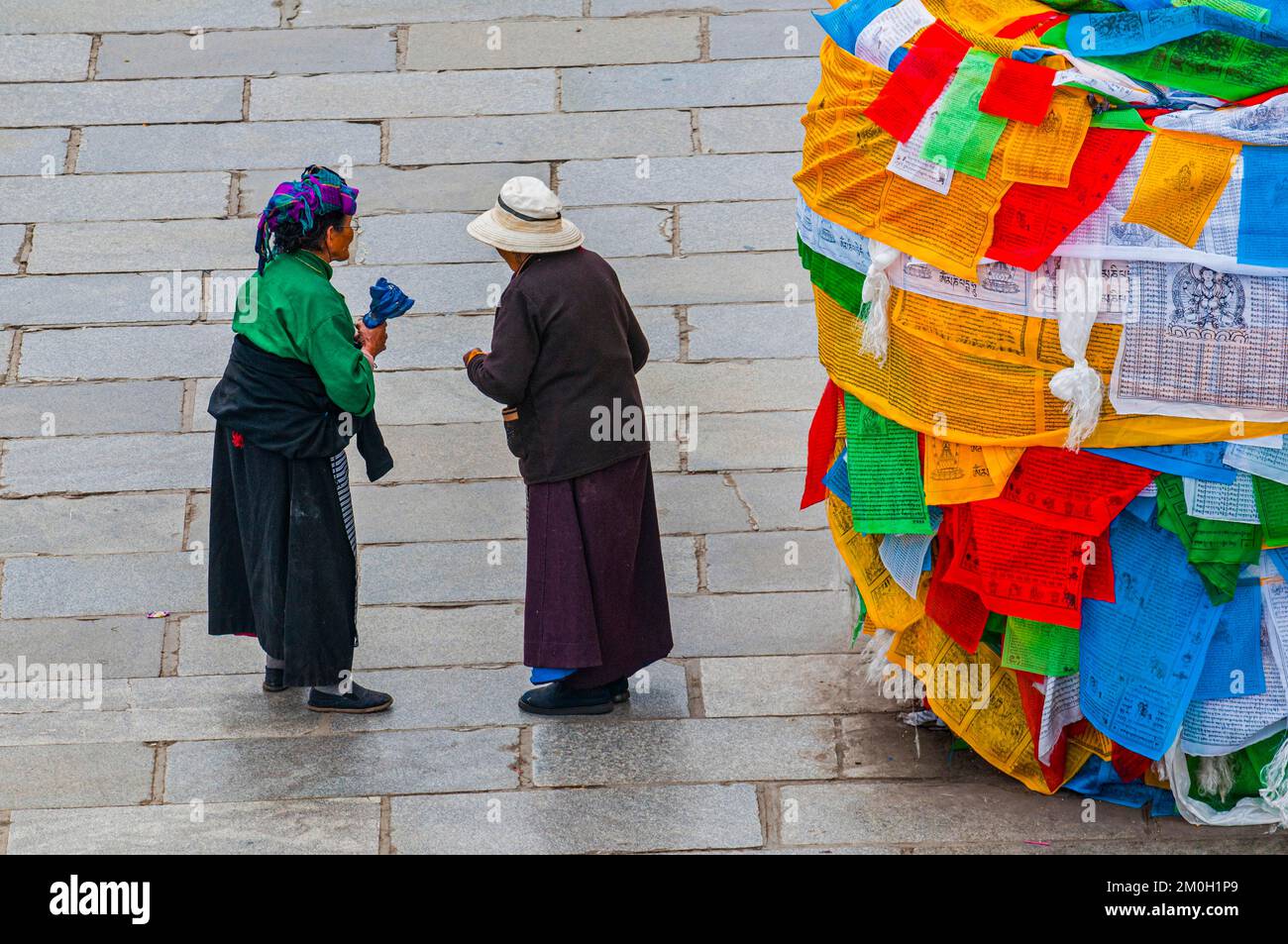 Tibetan pilgrims praying before the Jokhang temple, Lhasa, Tibet, Asia ...