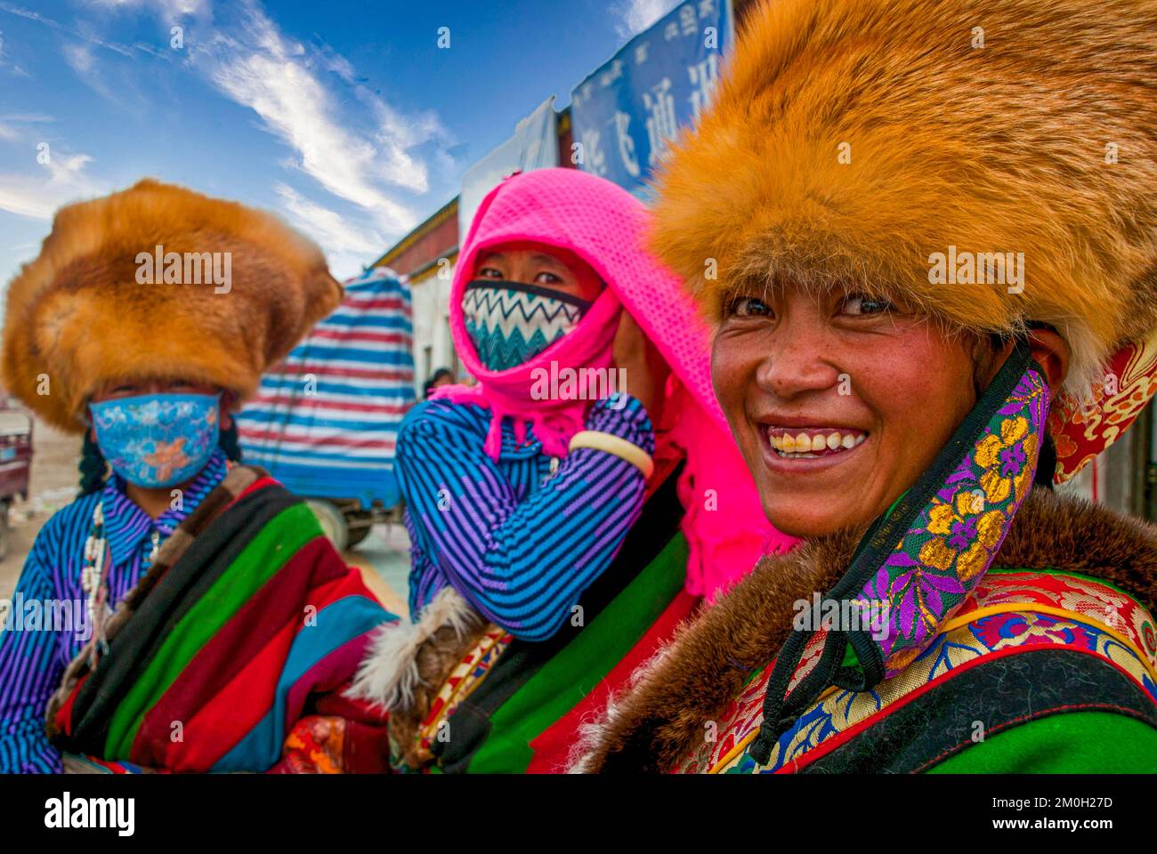Traditional dressed women in the town of Tsochen, West Tibet, Asia ...