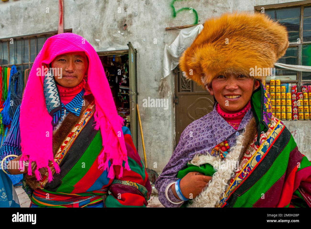Traditional dressed women in the town of Tsochen, West Tibet, Asia ...
