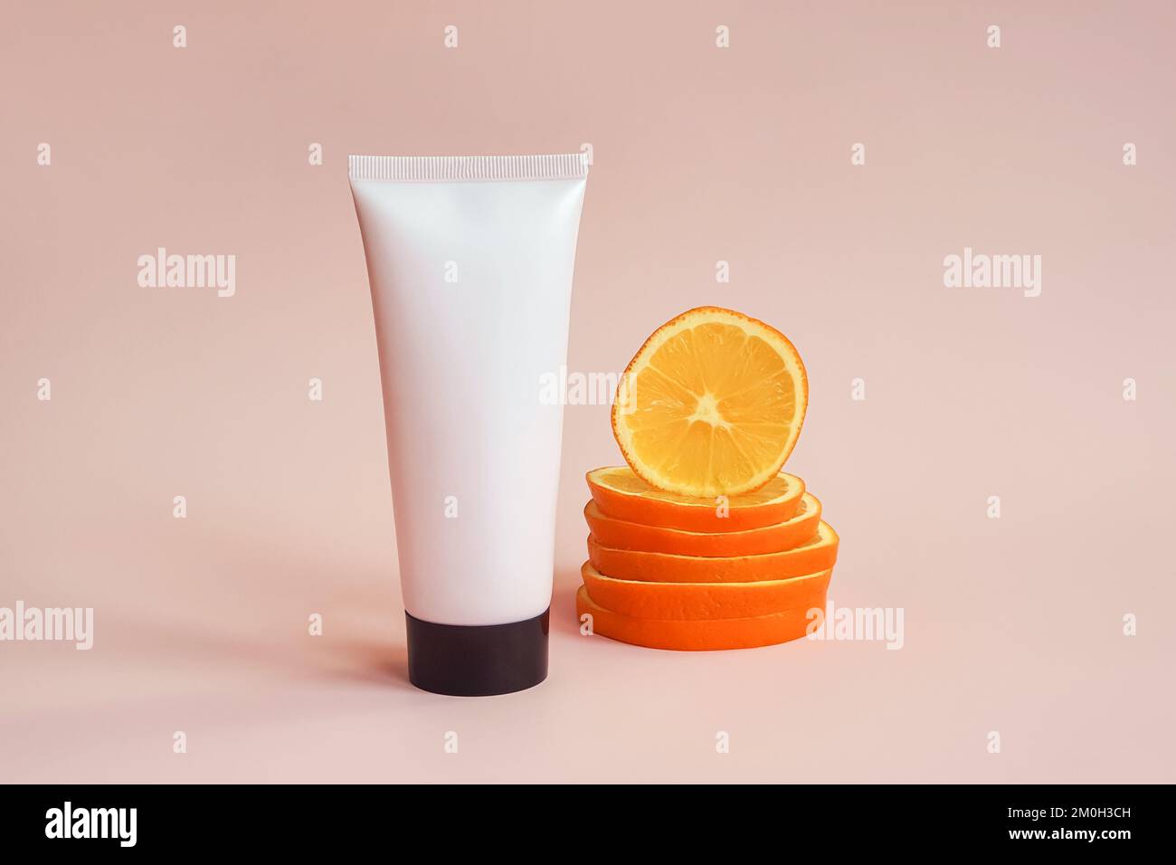 Mockup pink squeeze bottle cosmetic tube with screw black cap and ...