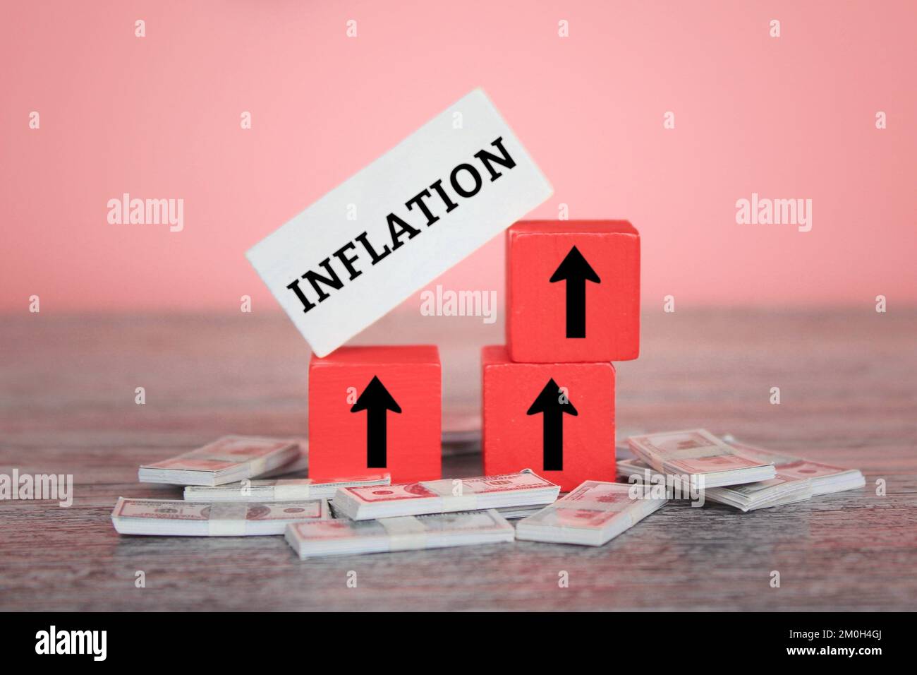 Upward arrow, money and wooden cube with text INFLATION. Increase in ...