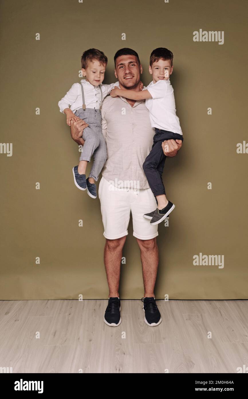 Father and two sons, parenting Stock Photo - Alamy