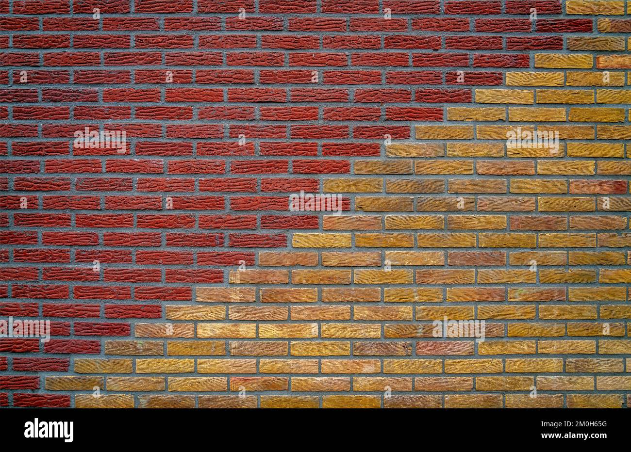 Background from red and yellow bricks wall Stock Photo - Alamy