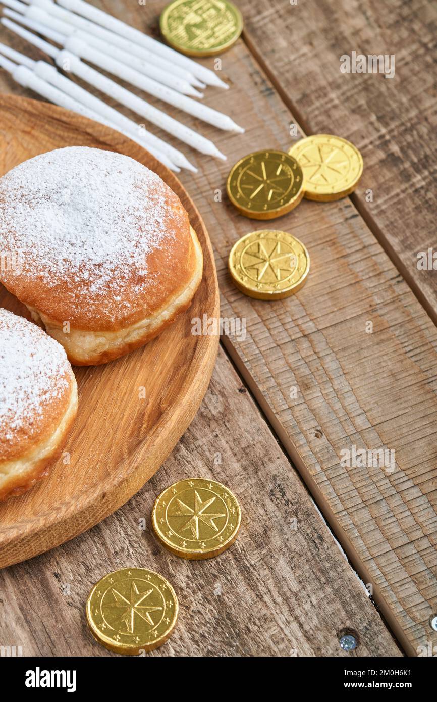 Happy Hanukkah. Hanukkah sweet doughnuts, gift boxes, white candles and ...