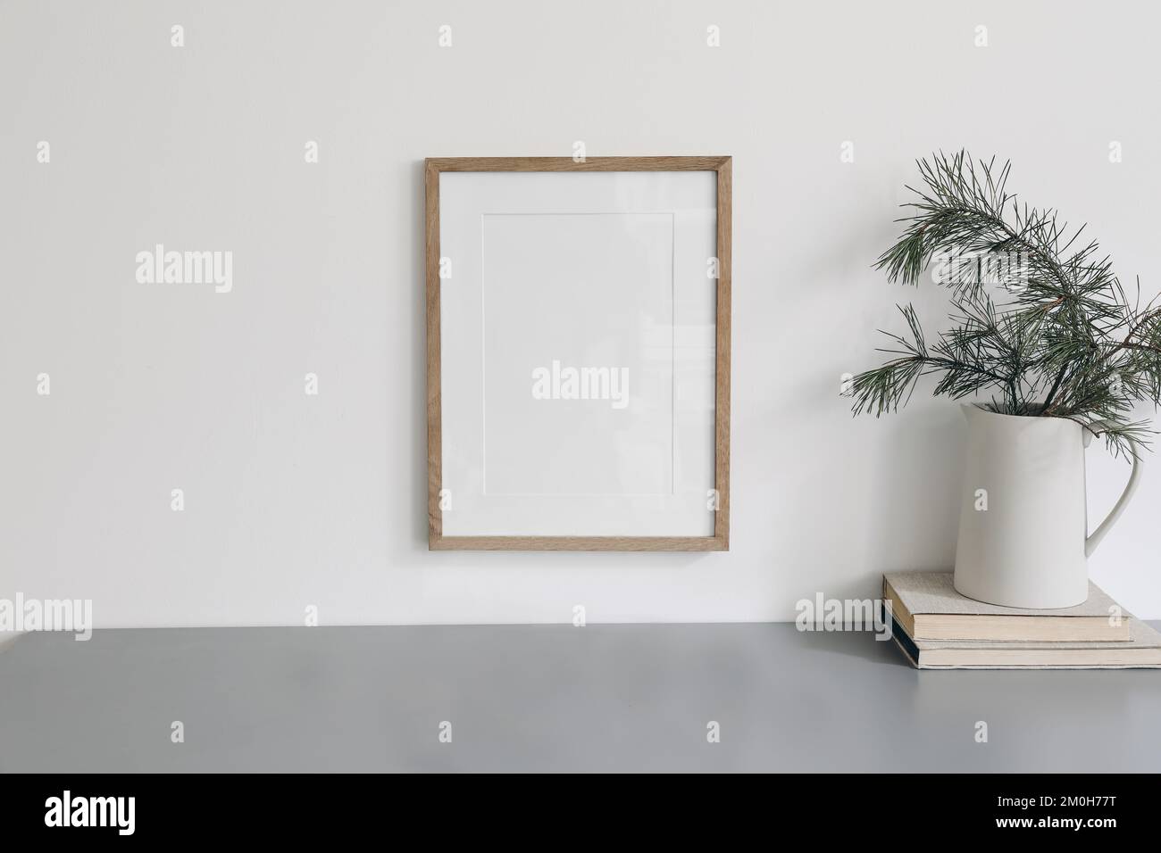 Christmas interior decor. Blank wooden picture frame mockup, white wall ...
