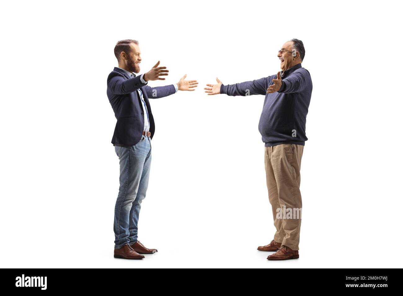 Young man meeting and greeting a mature man isolated on white ...