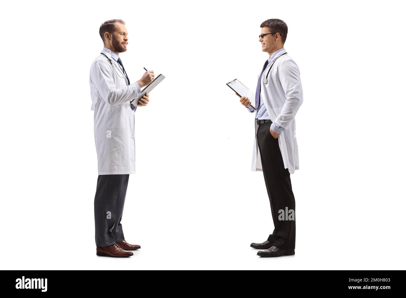 Two male doctors discussing isolated on white background Stock Photo ...