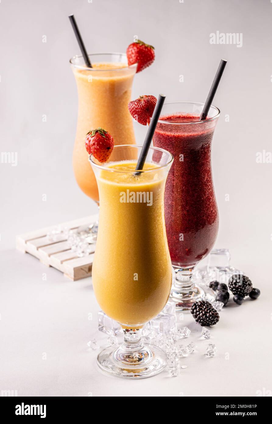 colorful smoothie concept with healthy and delicious drinks with ice ...