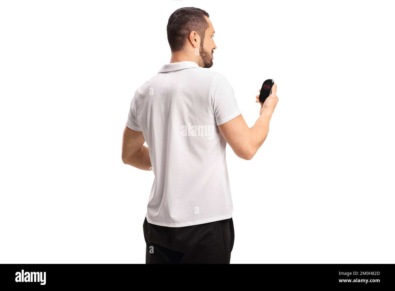 Sports coach holding a stopwatch isolated on white background Stock ...