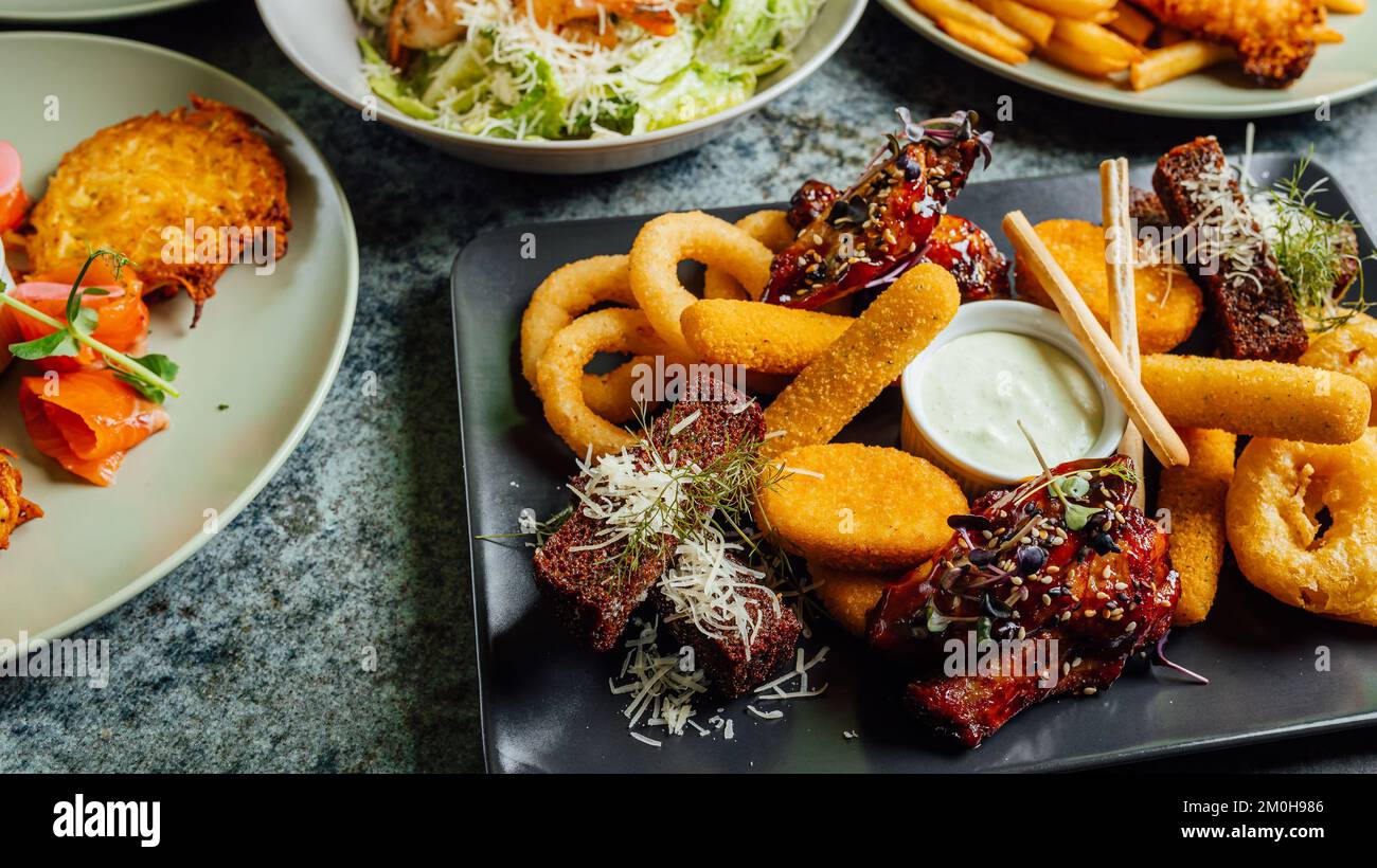 A top view of different meals with cheese nuggets and snacks Stock ...