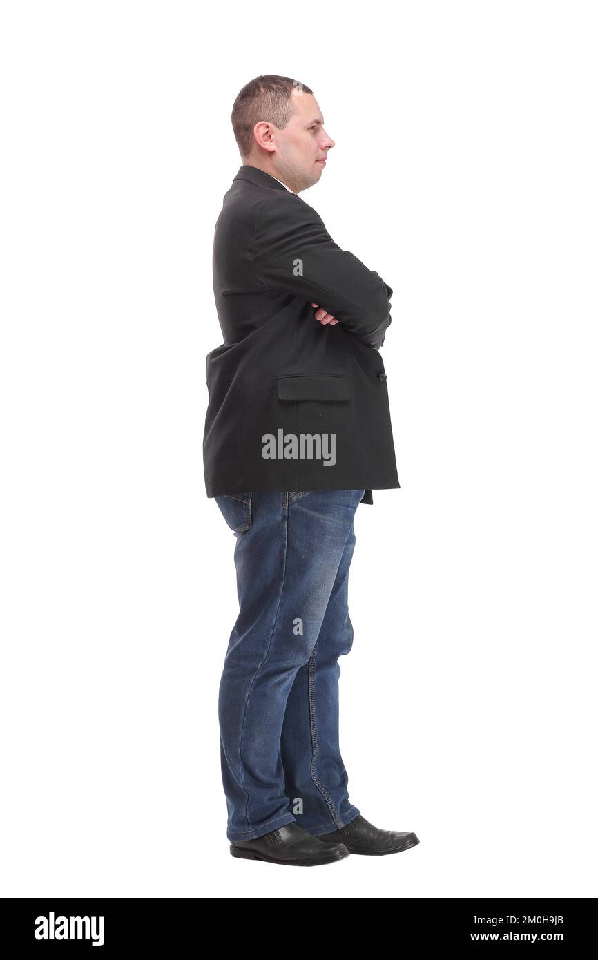 Side view of confident businessman with arms folded against white ...