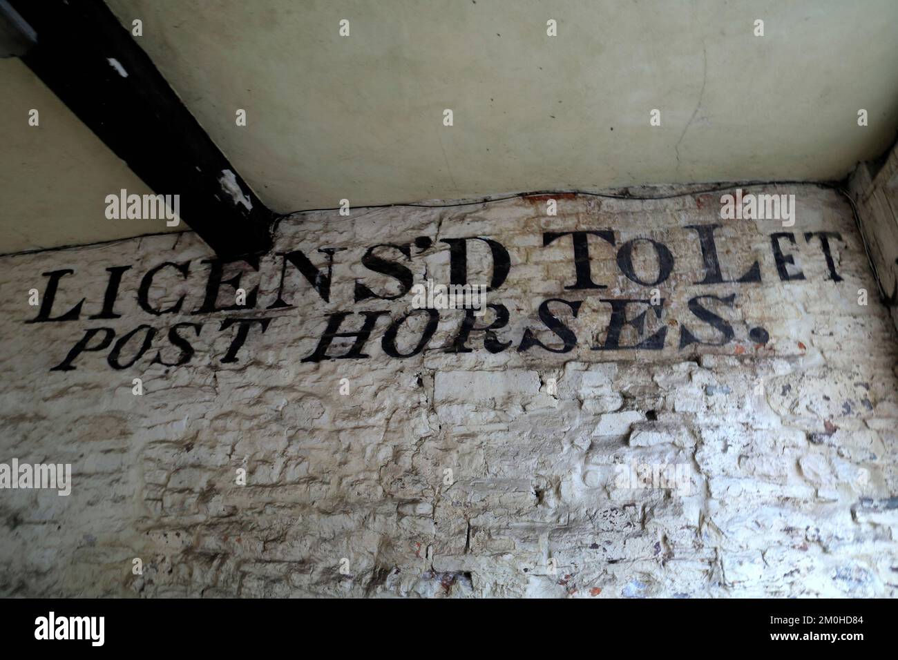 Very old sign written on public house outer wall - Licens'd To Let Post ...