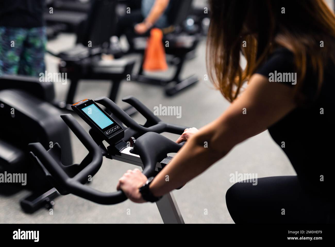 faceless model with long hair working out in gym Stock Photo - Alamy