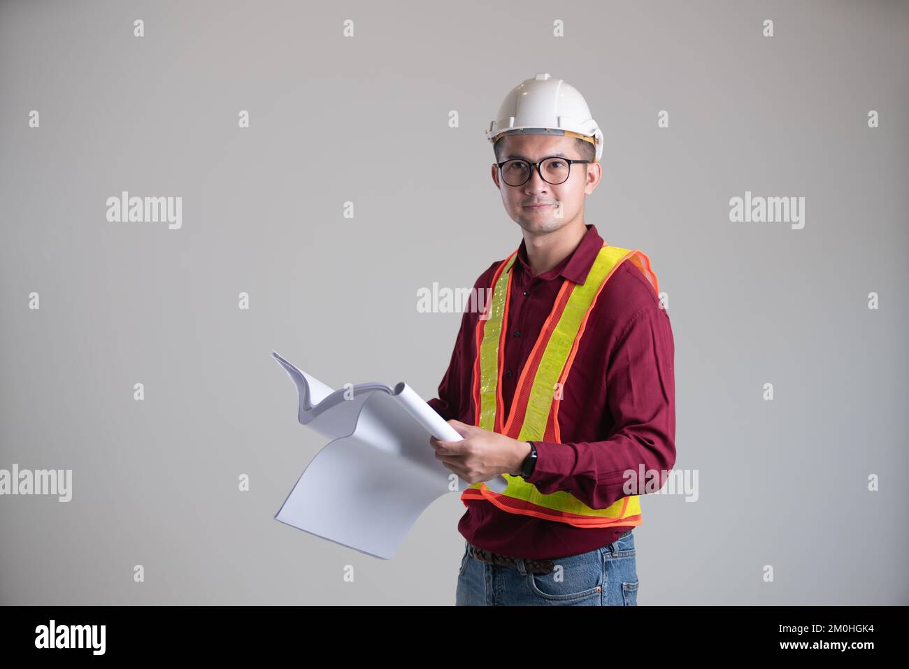 portrait engineering holding the blueprint Stock Photo - Alamy