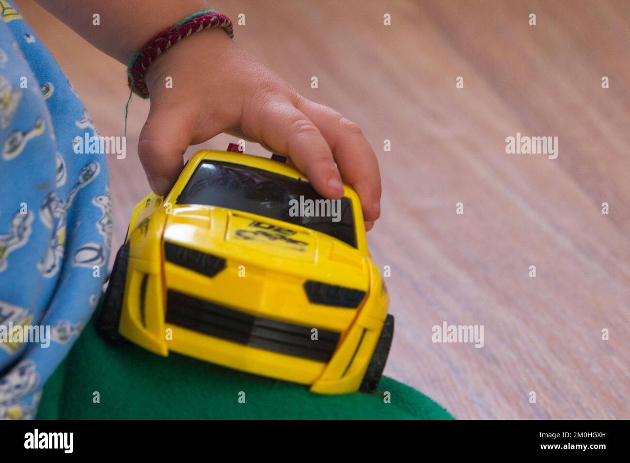 Kids hand holding toy car hi-res stock photography and images - Alamy