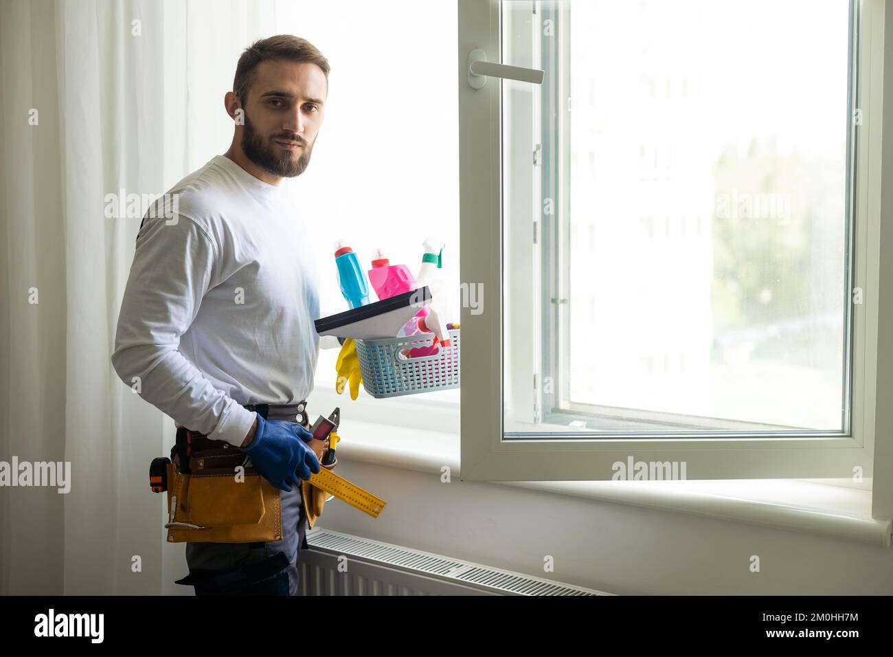 Professional cleaning, man washes window Stock Photo - Alamy