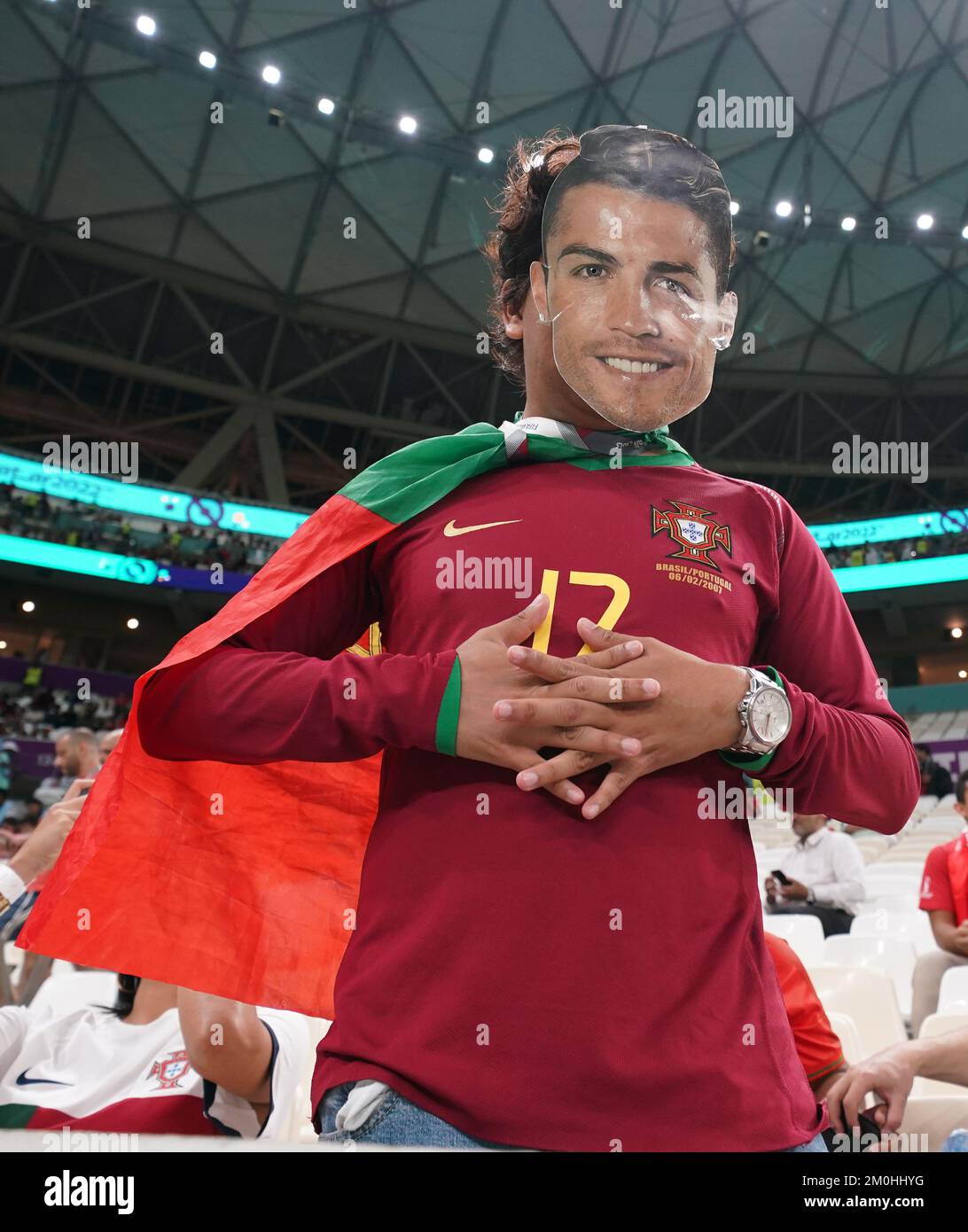 A Portugal fan in the stands wearing a Cristiano Ronaldo mask before ...