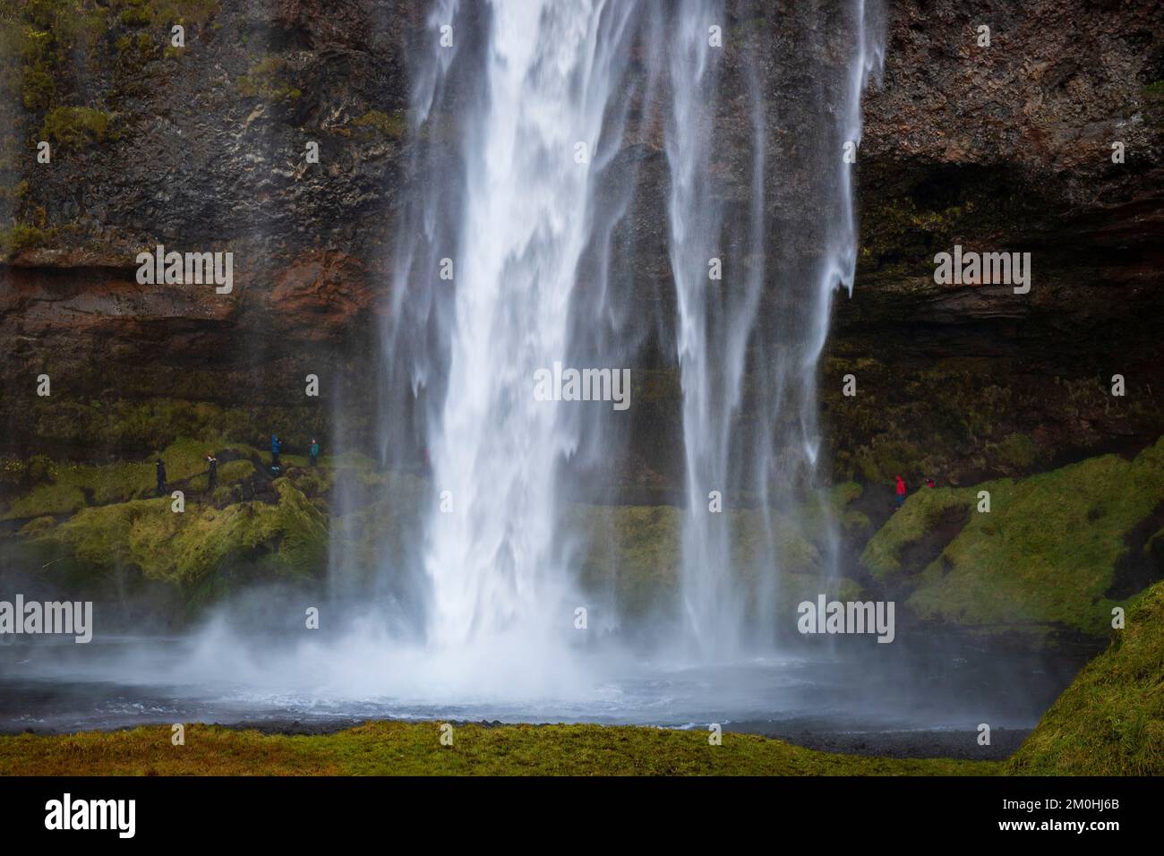 Iceland, Sudurland region, Seljalandsfoss waterfall 60 m high, figures ...