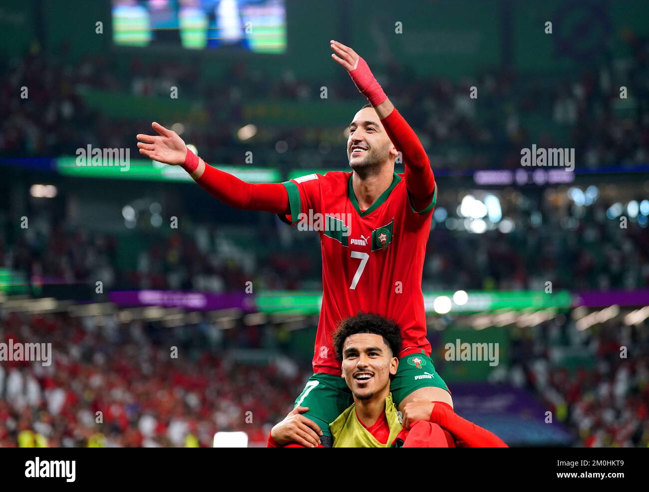 Morocco's Zakaria Aboukhlal (bottom) and Hakim Ziyech celebrate after ...
