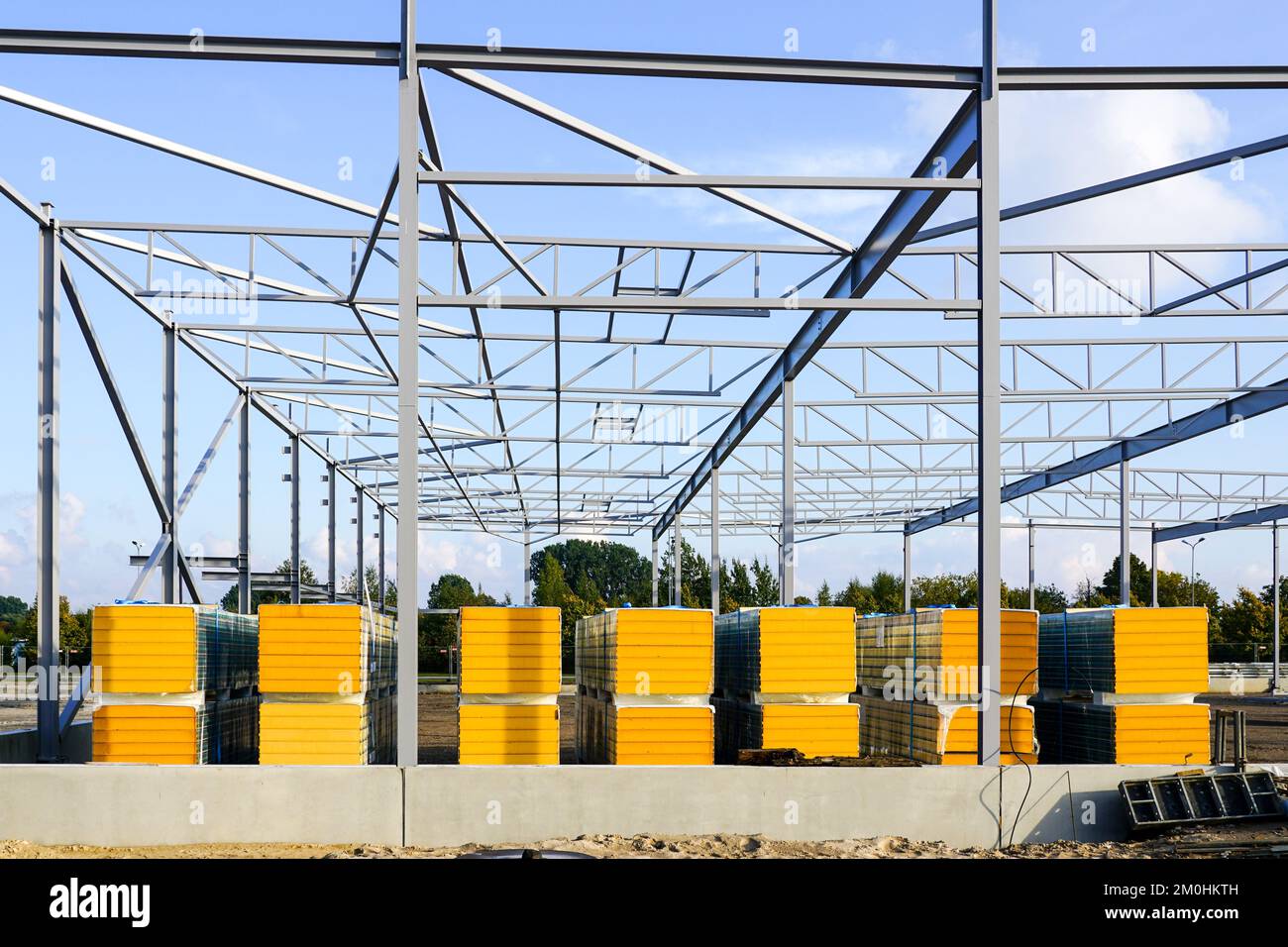 Assembled steel frame and stacks of sandwich panels for the facade of a ...