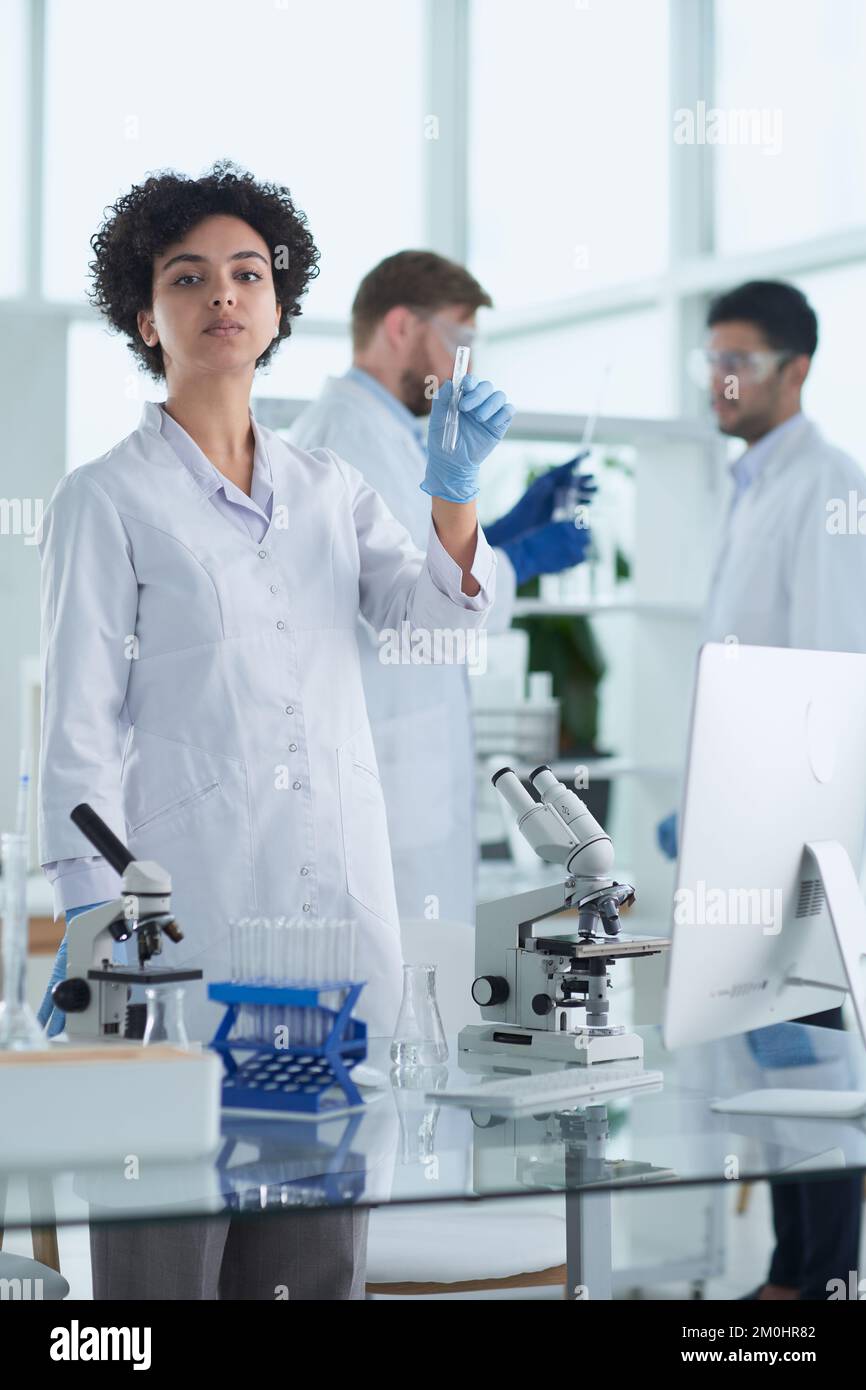 Smiling scientists looking at camera arms crossed in laboratory Stock ...