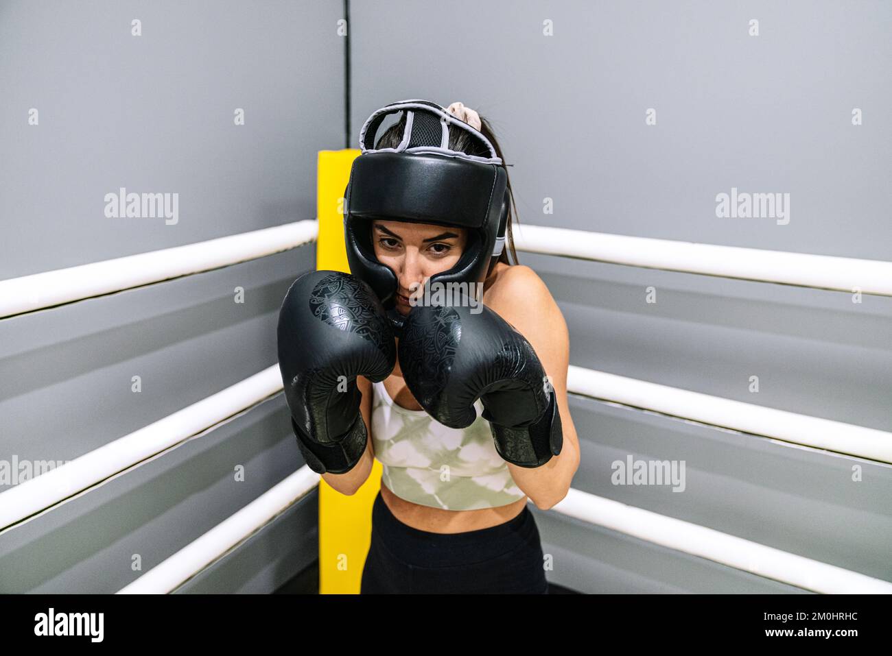 Young boxer woman staying in guard position in boxing ring Stock Photo ...