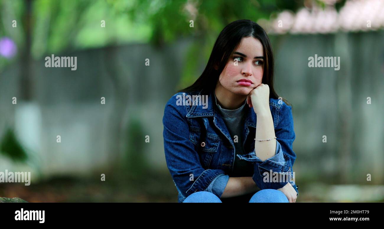 Frustrated young woman feeling regret and bad memories Stock Photo - Alamy